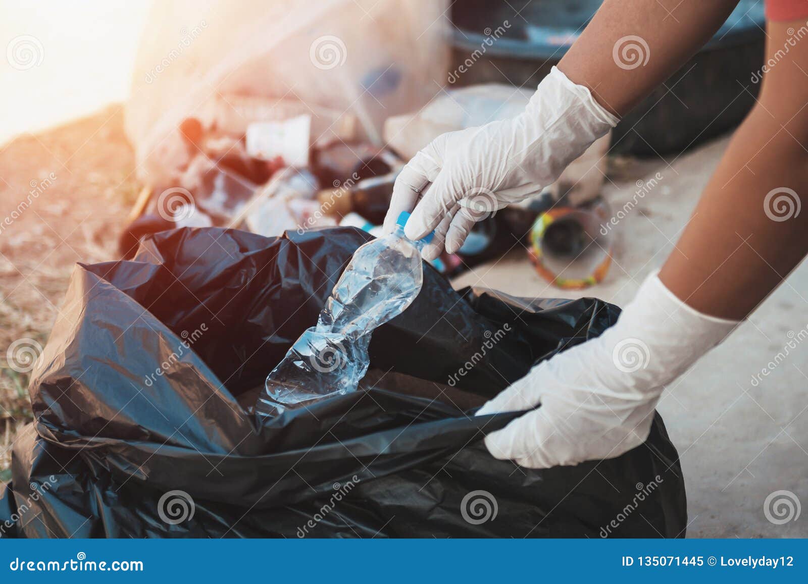 Hand Putting Empty Plastic Bottle in To Garbage Bag Stock Image - Image ...