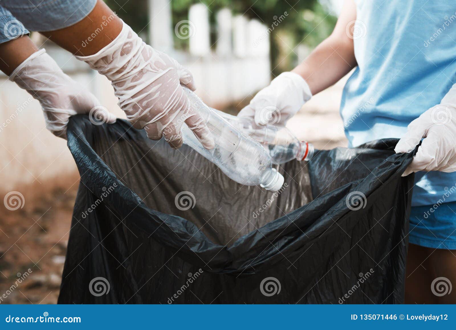 Hand Putting Empty Plastic Bottle in To Garbage Bag Stock Photo - Image ...