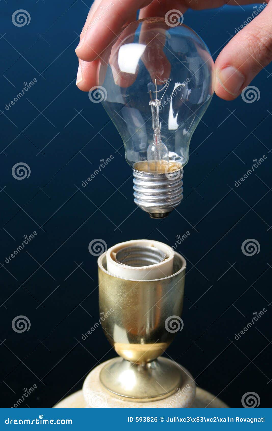 Hand Putting a Light Bulb in a Lamp Stock Photo - Image of bulb, think ...
