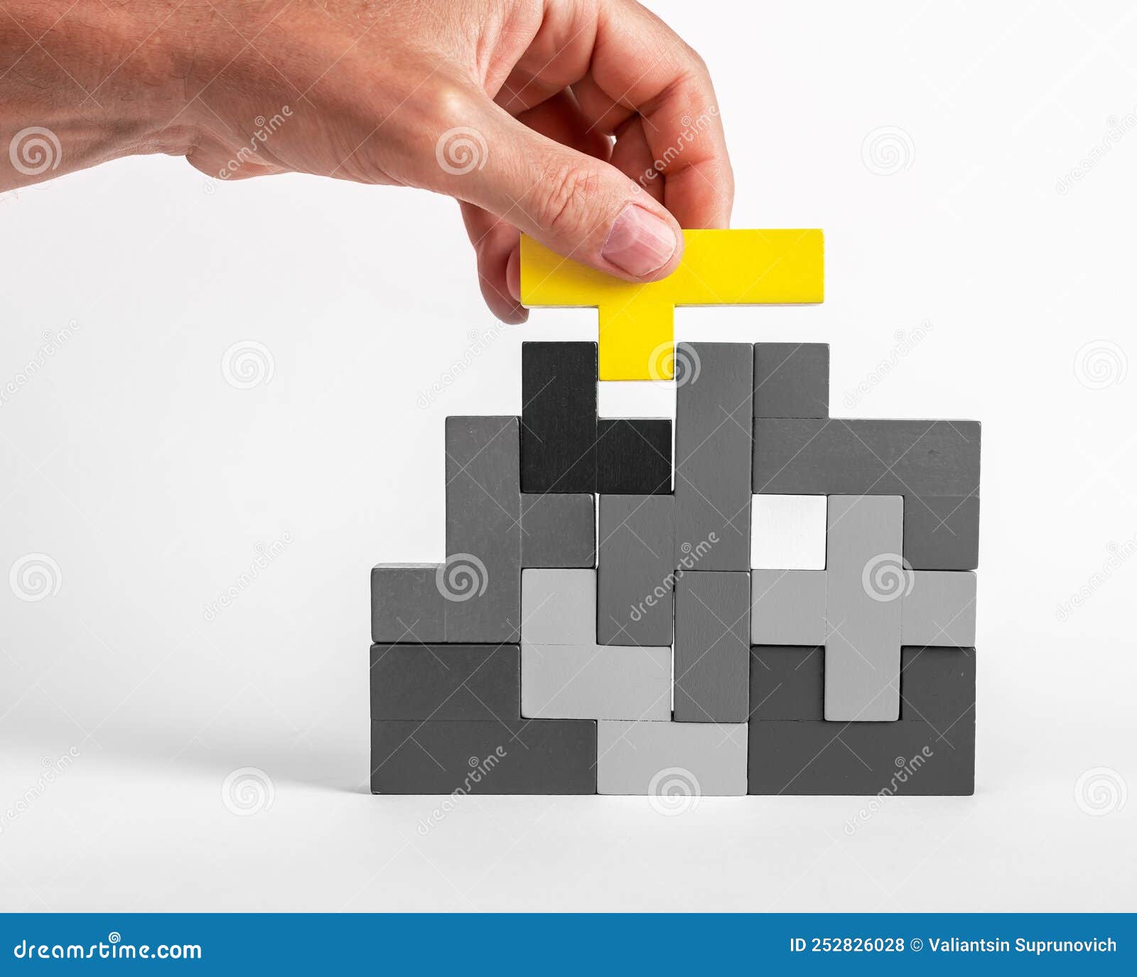 Putting Tetris Puzzle Pieces Together. Wooden Logic Game For Children ...