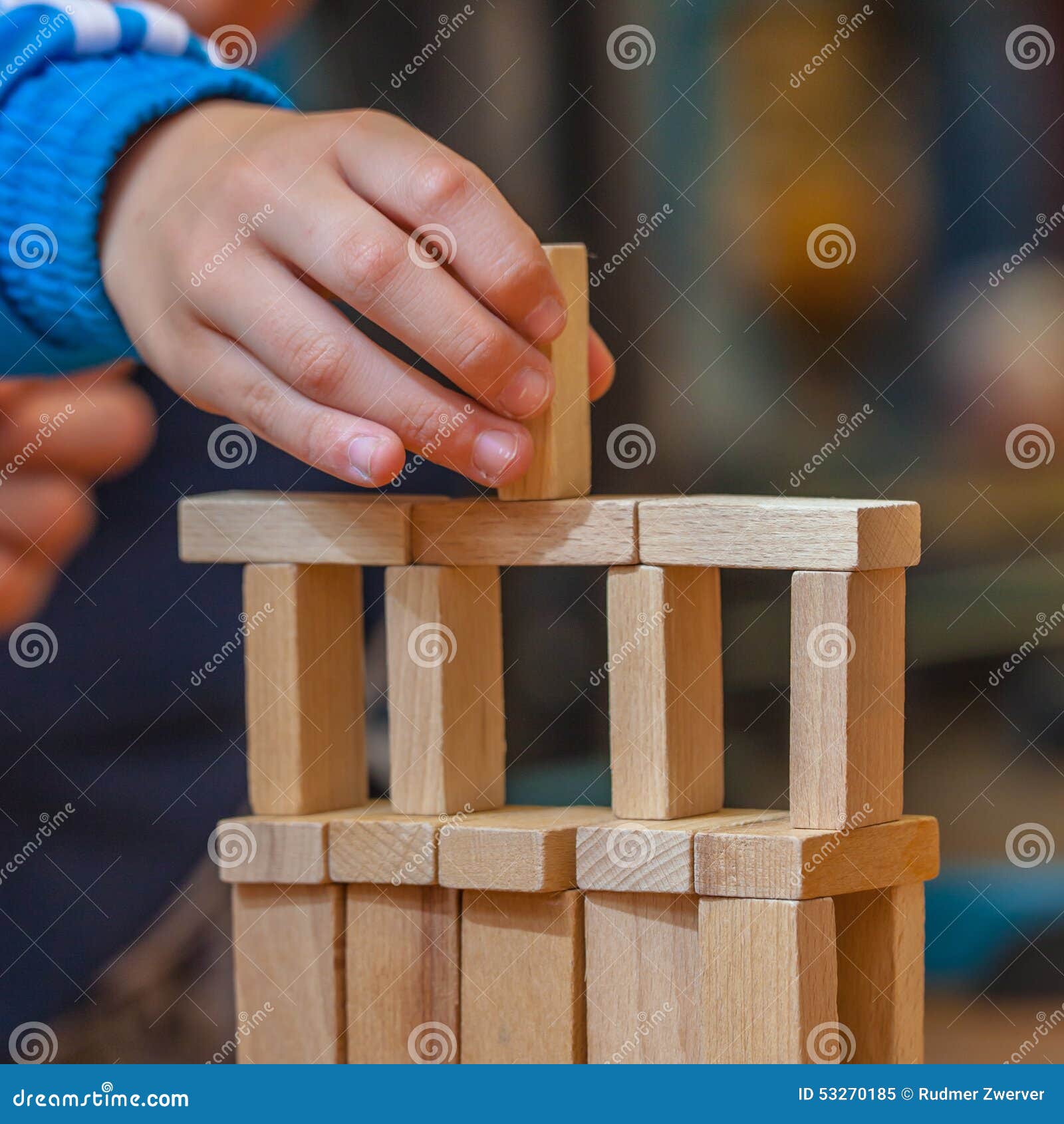 Hand Putting Wood Building Block on a Constuction Stock Image - Image ...