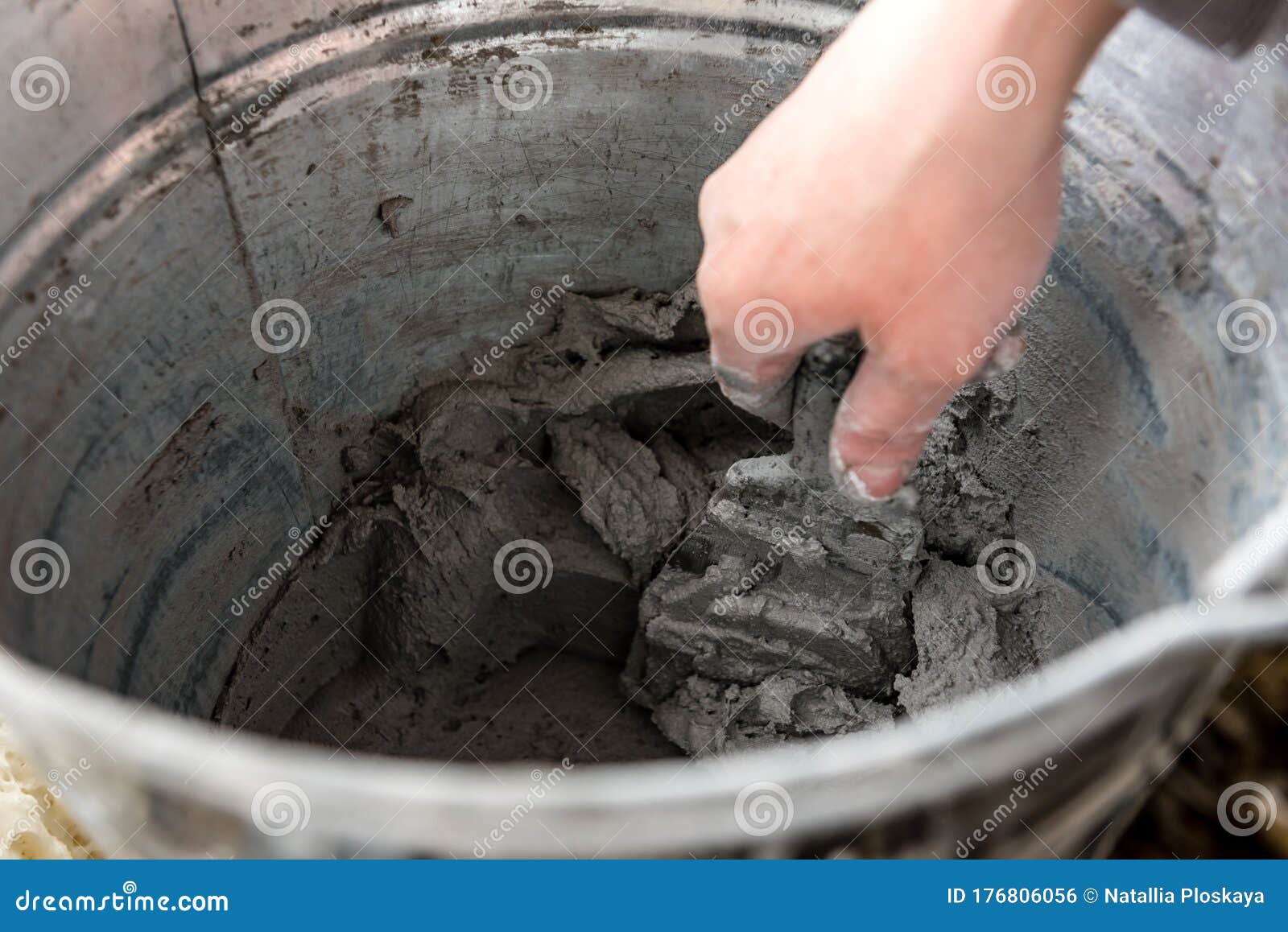 Hand with Putty Knife in Bucket of Plaster Stock Photo - Image of work ...