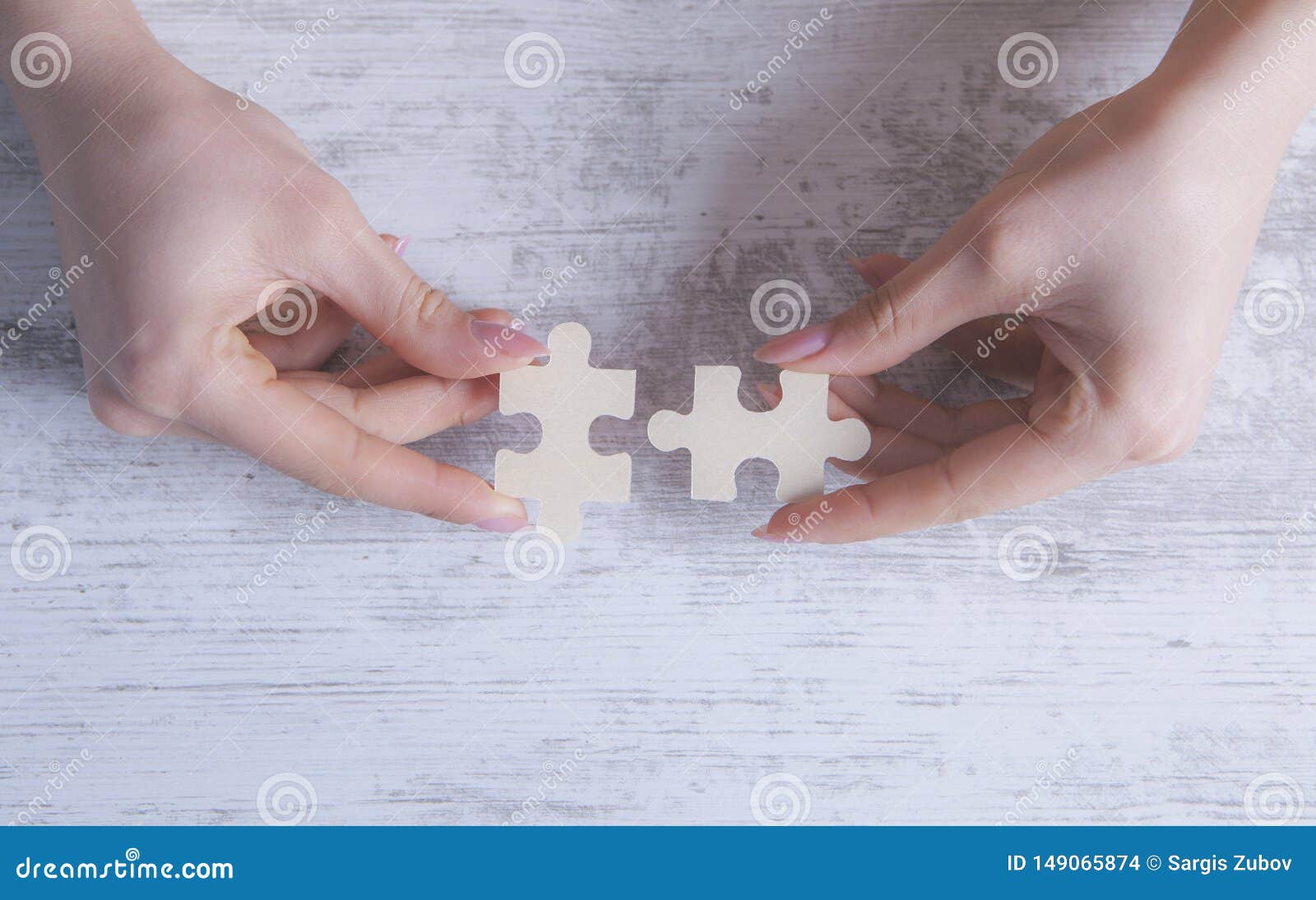 Hand and puzzle stock photo. Image of puzzle, form, coincide - 149065874