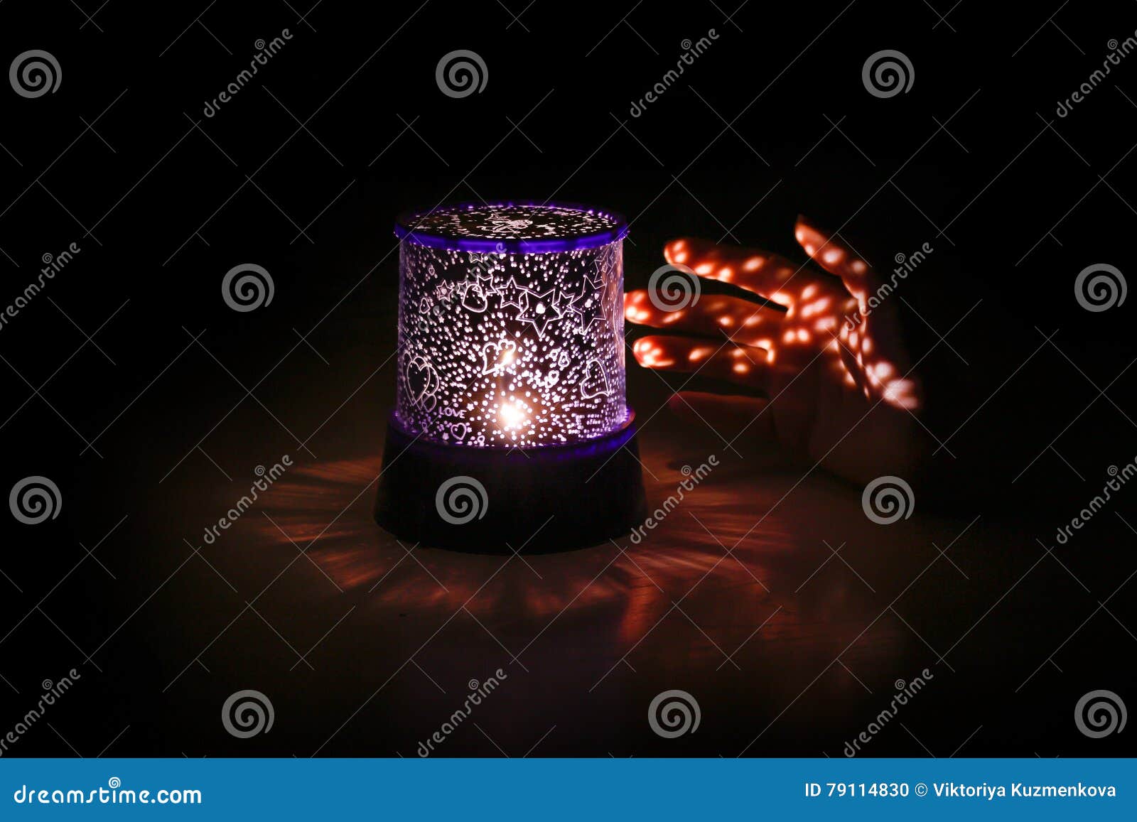 The Hand Reaches for a Beautiful Night Lamp in the Dark Stock Photo ...