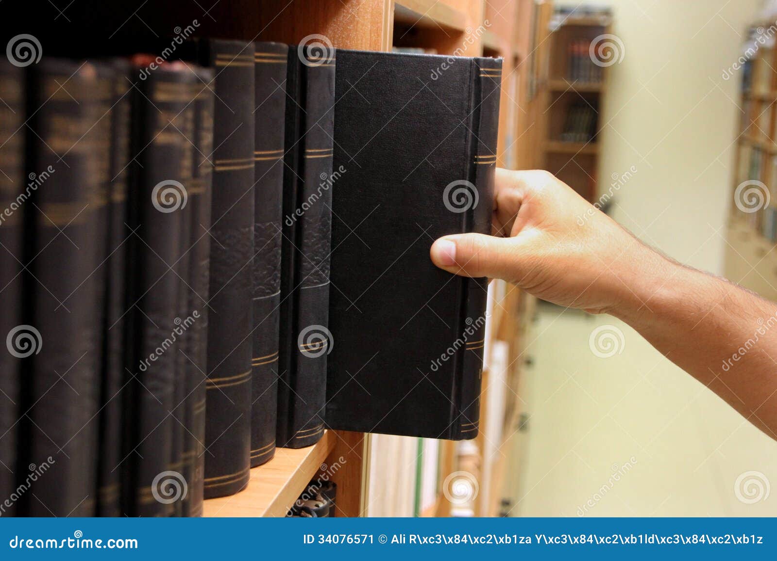 Hand Reaching for Book on a Shelf Stock Image - Image of collage ...