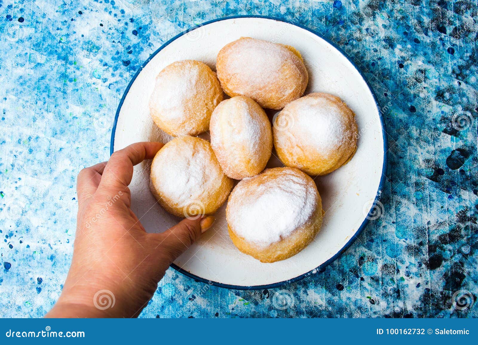 Hand Reaching a Doughnut from a Plate Stock Photo - Image of female ...