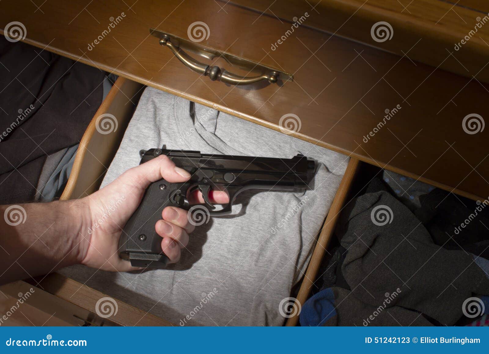 Hand reaching for handgun stock image. Image of violence - 51242123