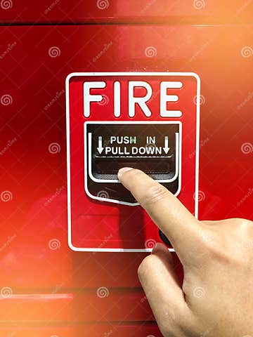 A Hand Reaching and Pulling a Red Fire Alarm Switch. Red Fire Alarm ...
