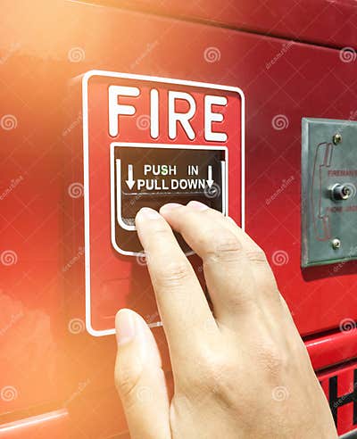 A Hand Reaching and Pulling a Red Fire Alarm Switch. Red Fire Alarm ...