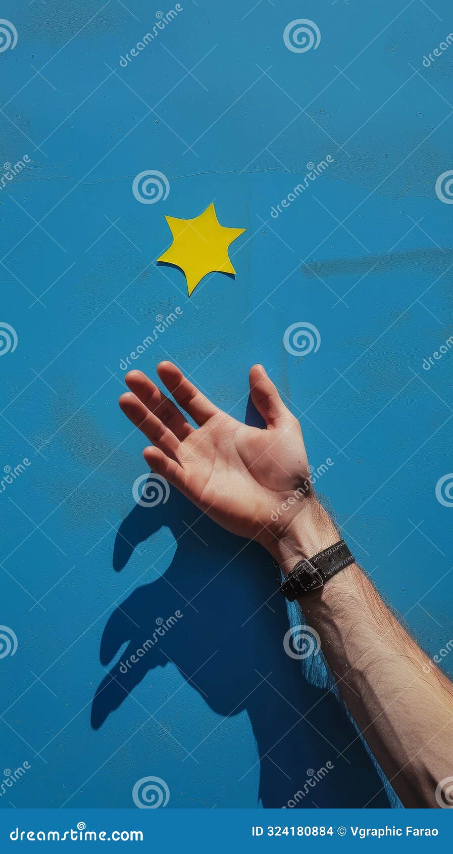 Hand Reaching Towards Yellow Star on Blue Background Stock Photo ...
