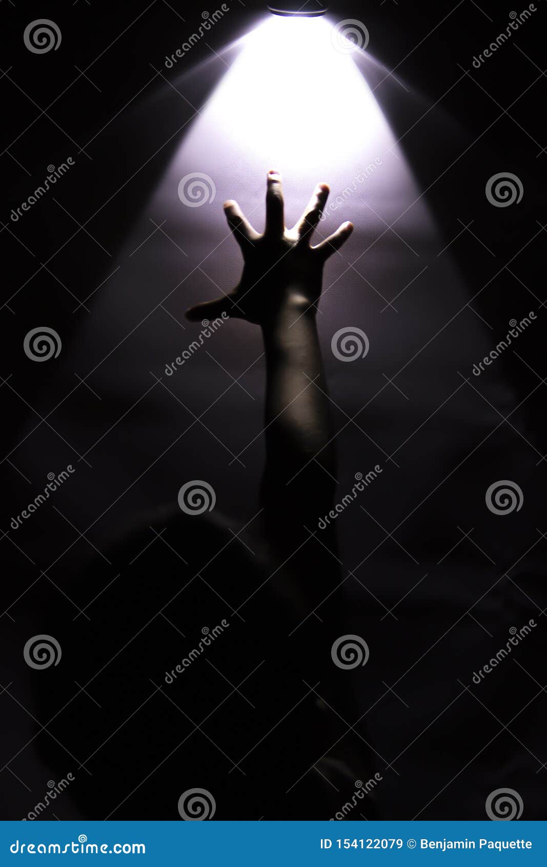 Hand Reaching Up To Touch a Glowing Light Stock Image - Image of ...