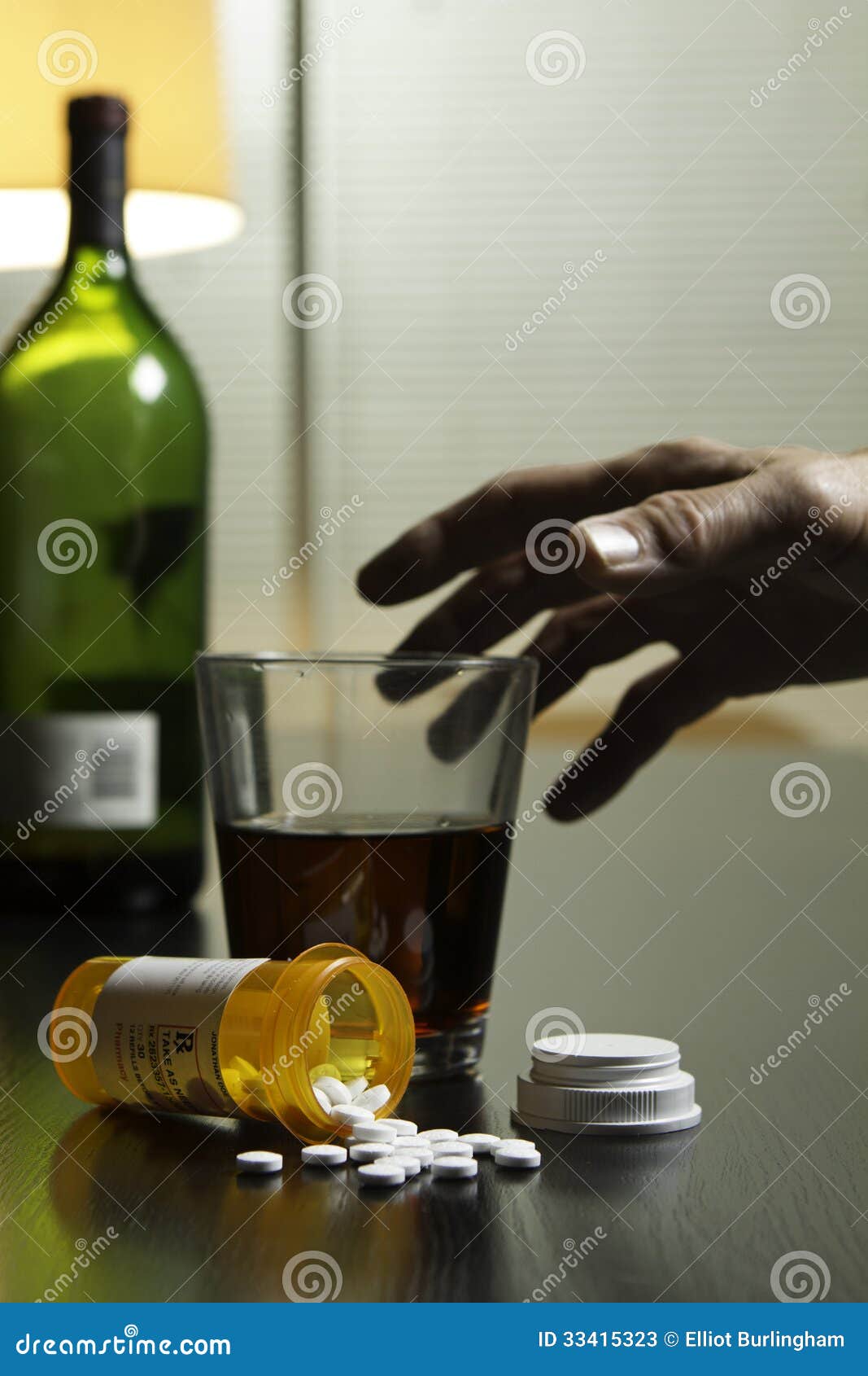 Hand Reaching for Wine and Prescription Pills on Table, Vertical Stock ...