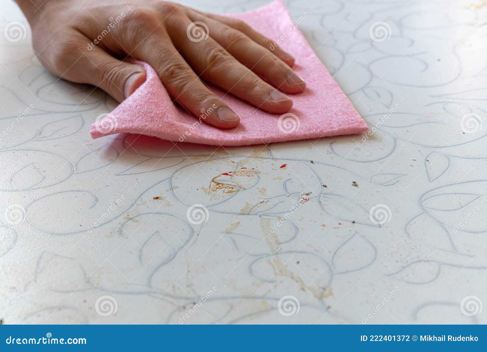 Hand with a Red Rag Wiping the Dirty Table Surface in Kitchen at Home ...