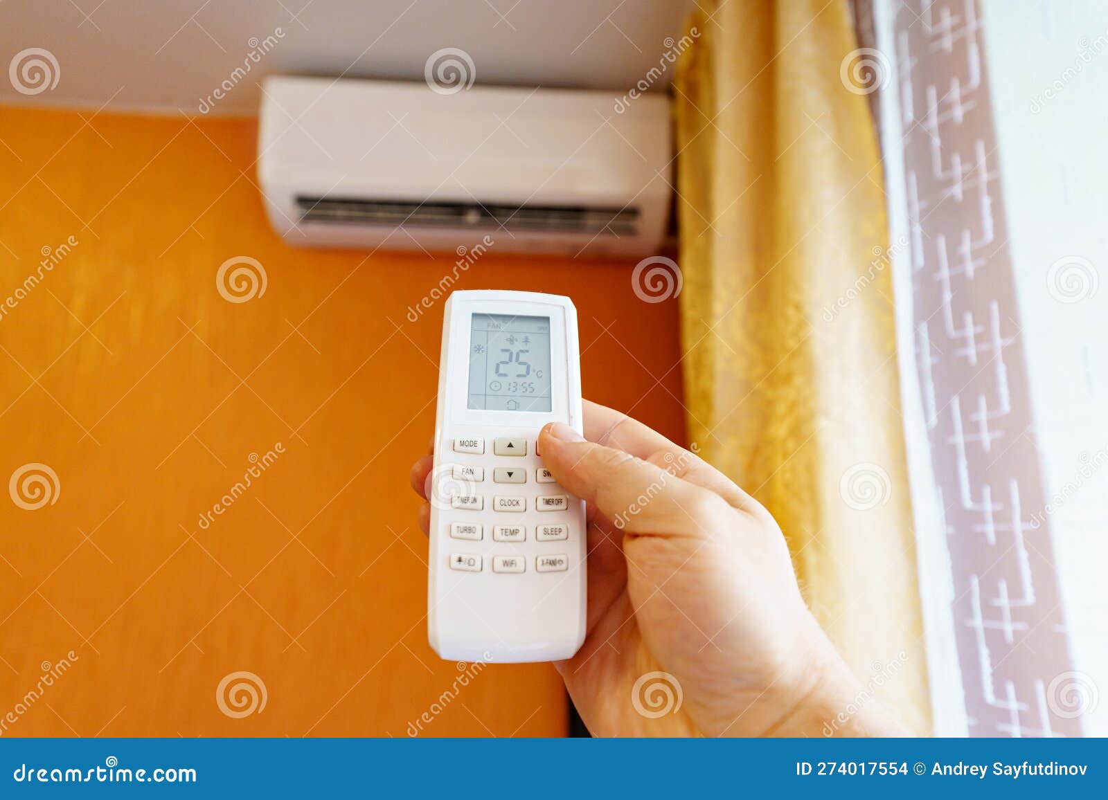 Hand with the Remote Control of the Air Conditioner. Stock Photo ...