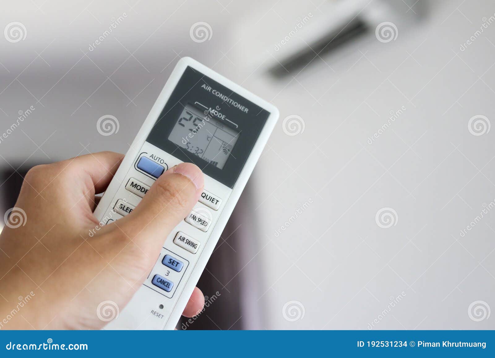Hand with Remote Control Directed on Air Conditioner Inside the Room ...