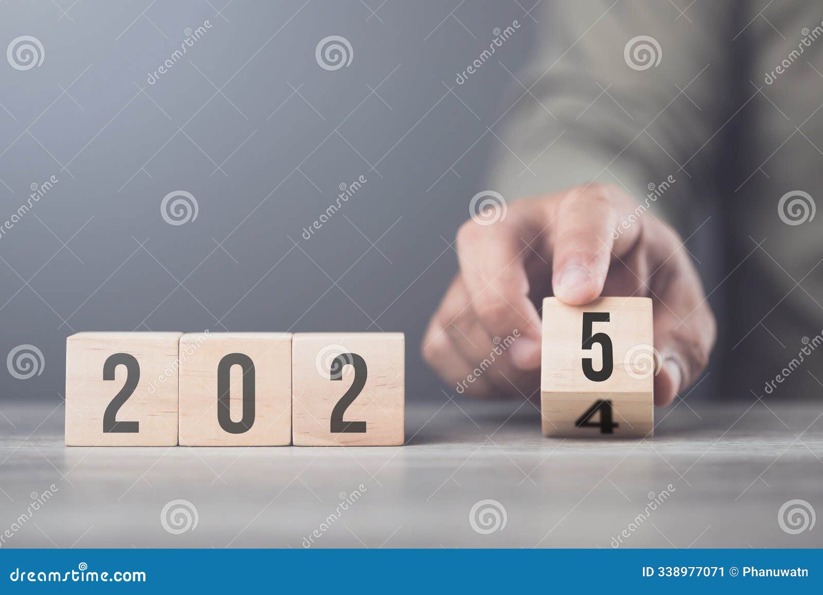 Hand Replaces 2024 with 2025 Using Number Blocks, Symbolizing the ...