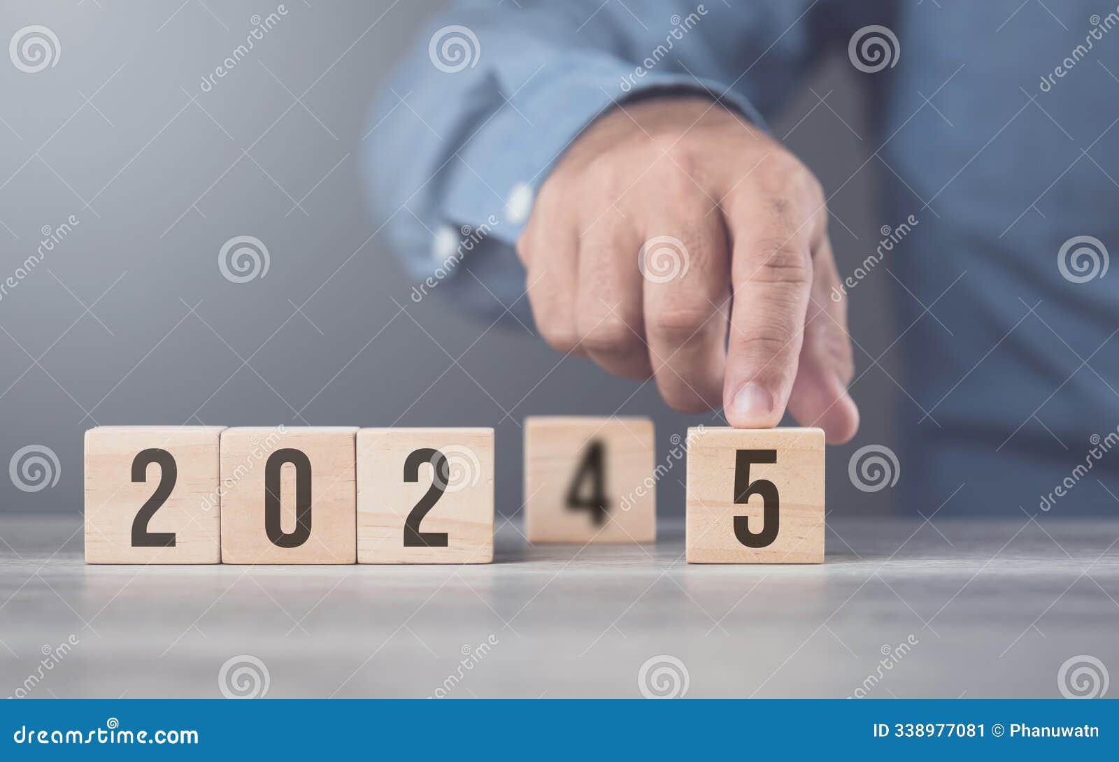 Hand Replaces 2024 With 2025 Using Number Blocks, Symbolizing The ...