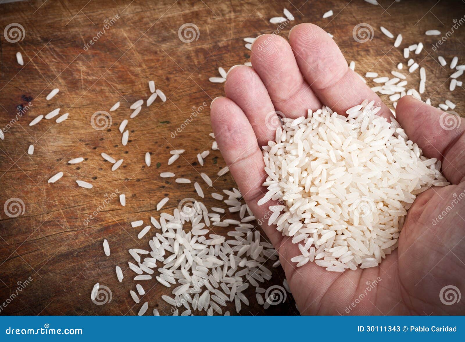 Hand with rice. stock image. Image of culture, kitchen - 30111343