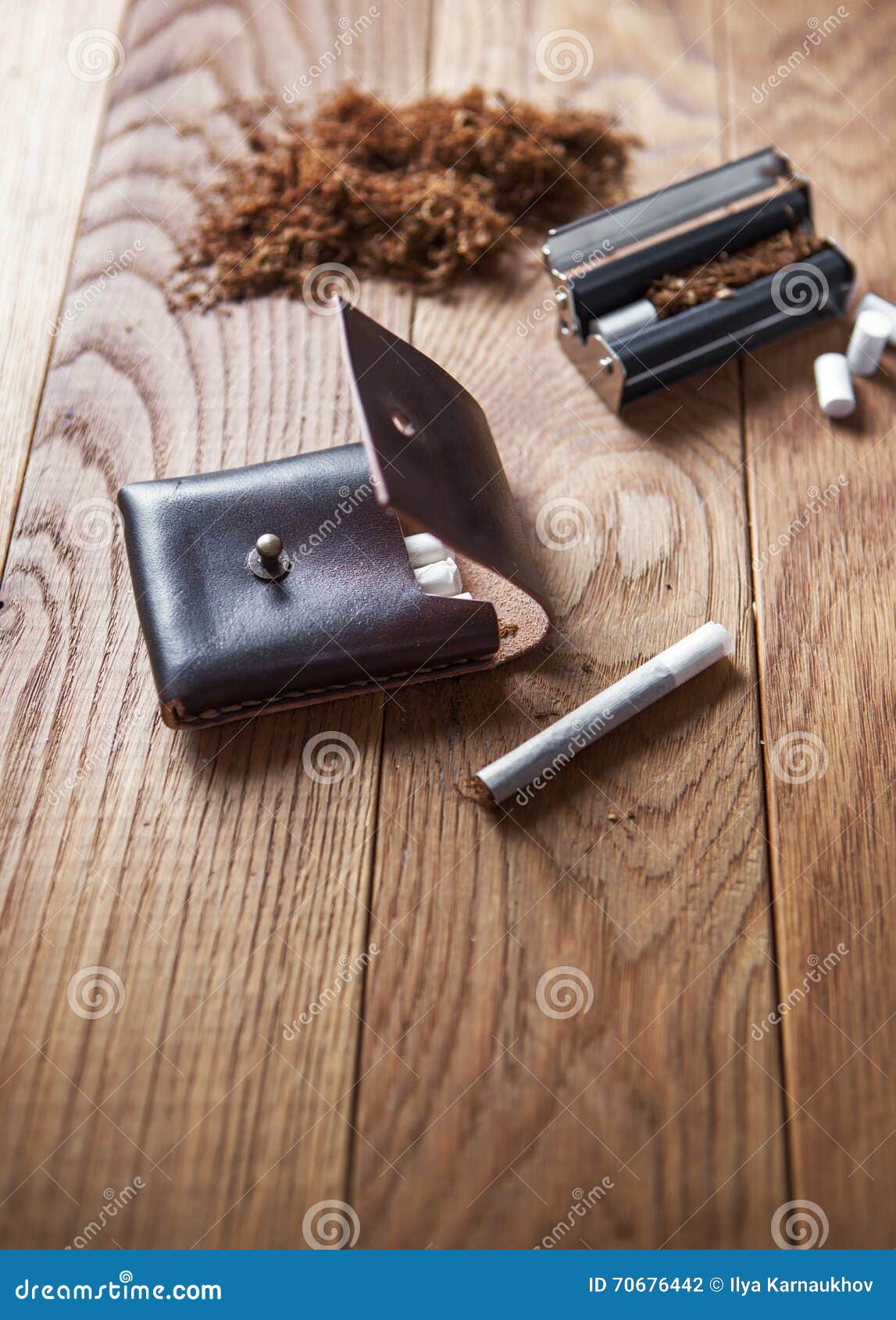 Hand rolling cigarettes stock photo. Image of closeup - 70676442