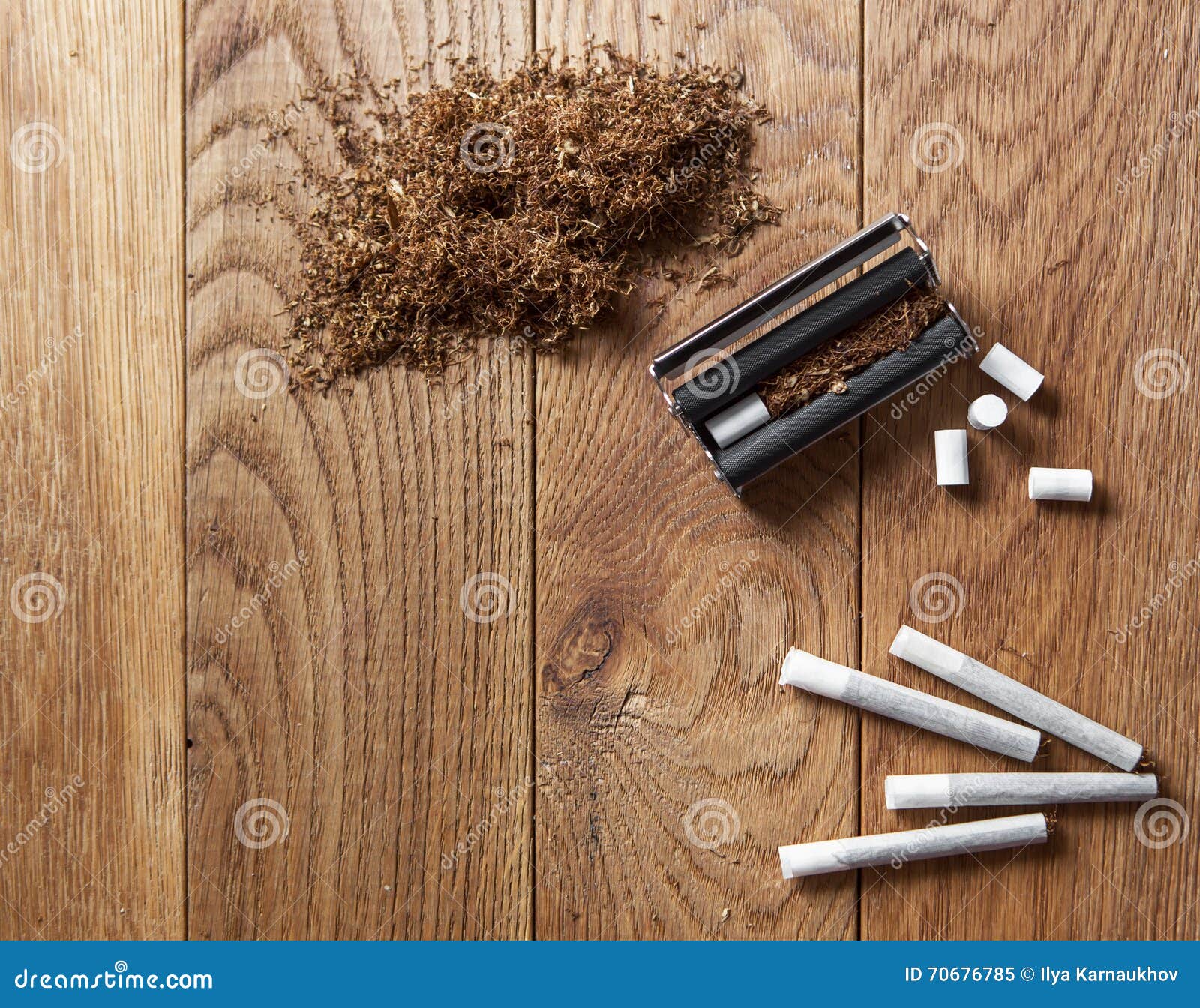 Hand rolling cigarettes stock image. Image of rolled - 70676785