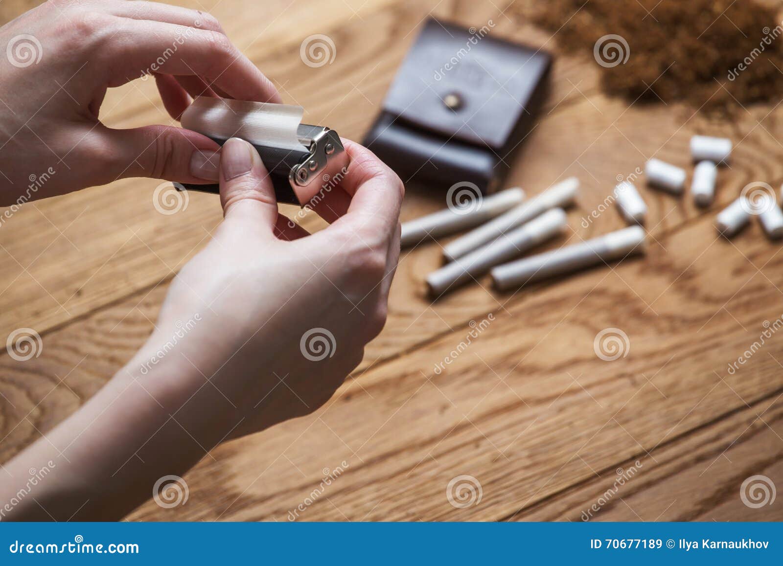 Hand rolling cigarettes stock image. Image of addiction - 70677189
