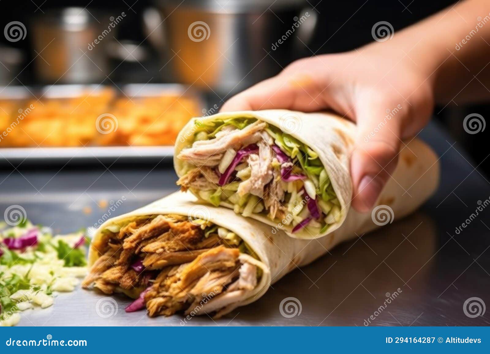 Hand Rolling a Perfect Shawarma with Stuffing Peeking Out Stock Image ...