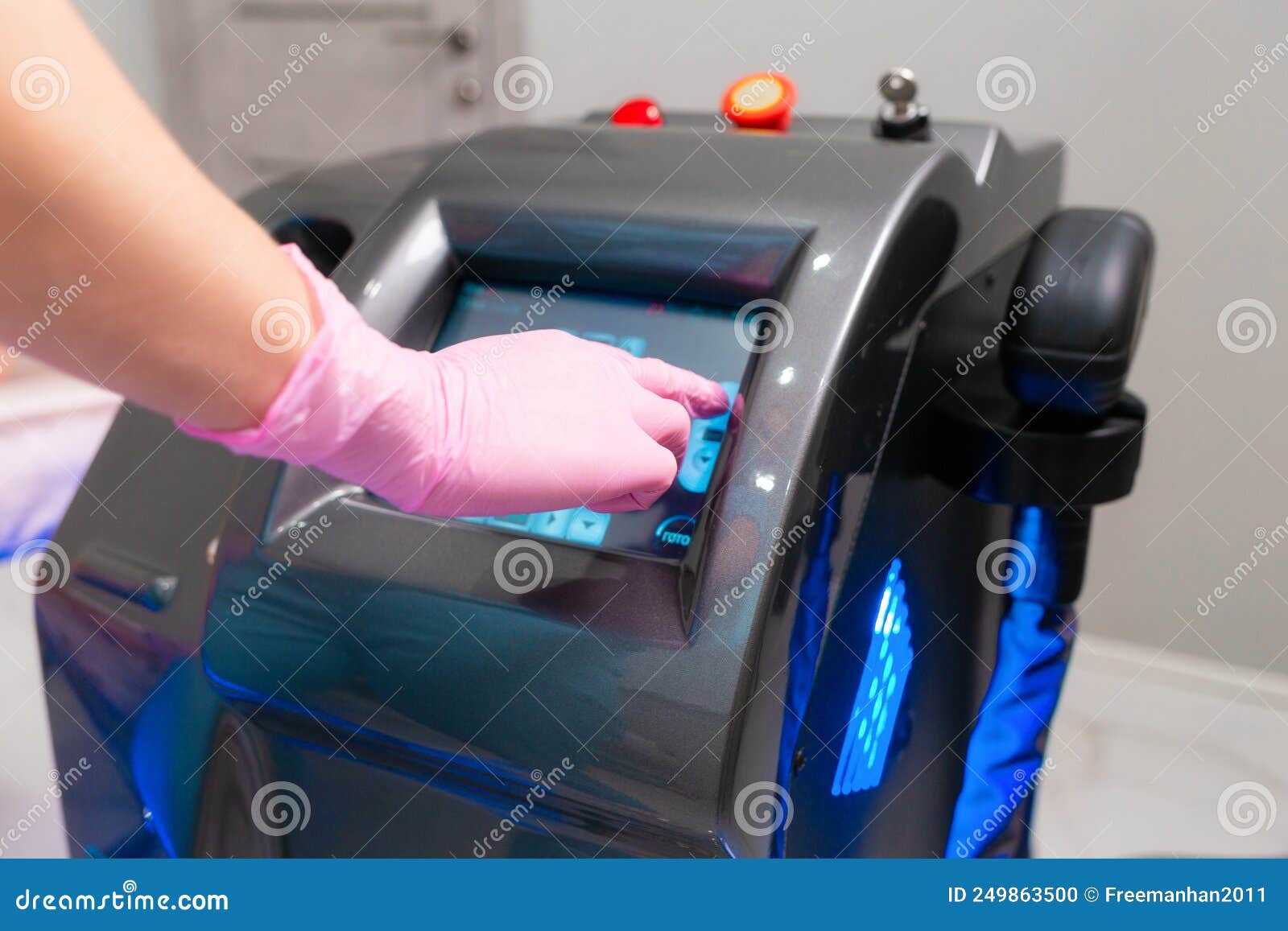A Hand in Rubber Gloves Presses at the Sensor Screen of the Laser ...