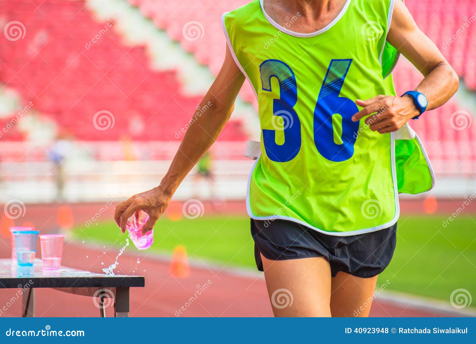 The Hand of the Runner Grabbing the Water Stock Photo - Image of ...