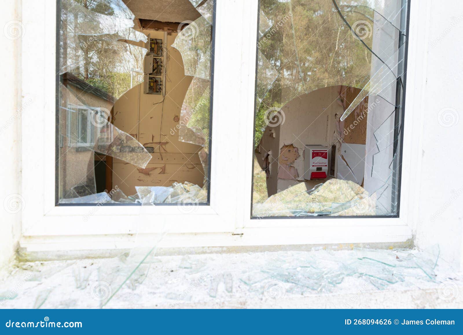 Hand Sanitiser Visible through Smashed Window of Abandoned Hospital ...