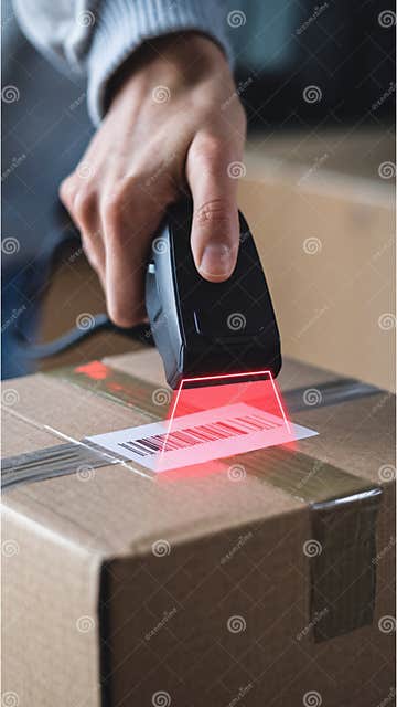 Hand Scans a Barcode on a Sealed Cardboard Box with a Barcode Scanner ...