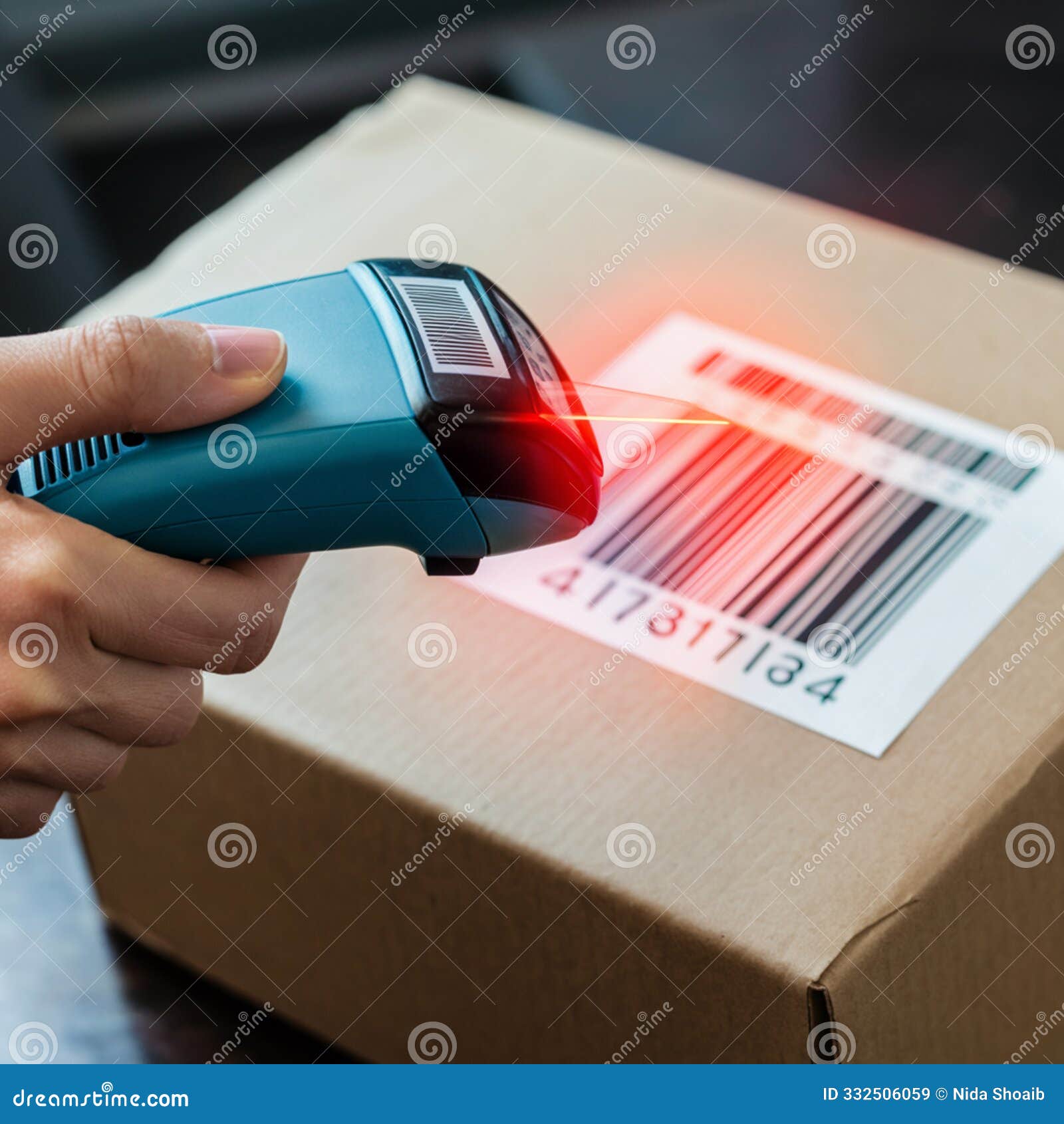 Hand Scans a Barcode on a Sealed Cardboard Box with a Barcode Scanner ...