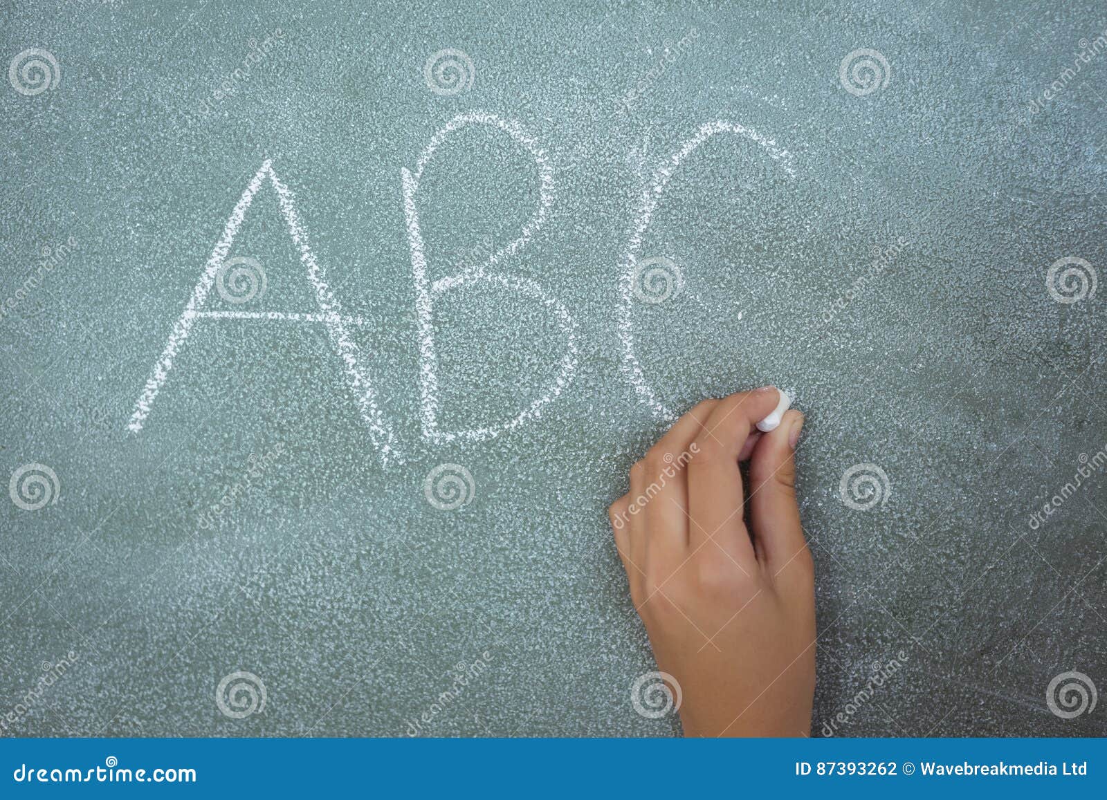 Hand of Schoolgirl Writing on Chalkboard in Classroom Stock Photo ...