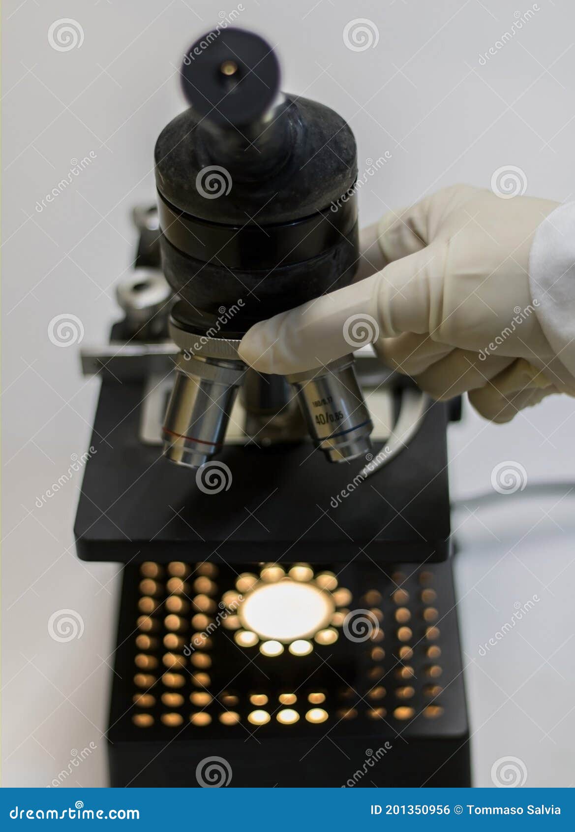 Hand of a Researcher while Adjusting a Microscope. Stock Photo - Image ...
