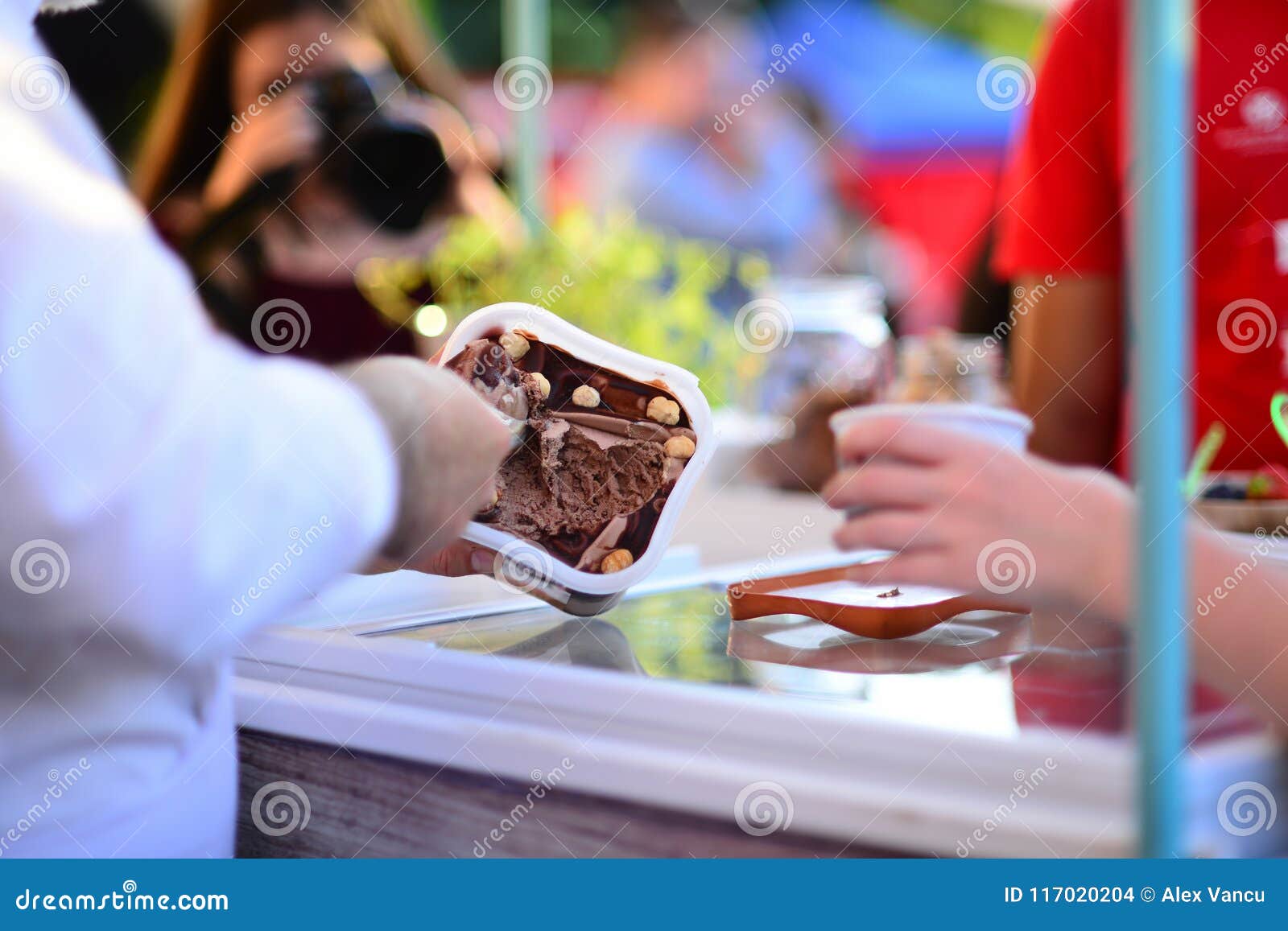 Hand scooping ice cream stock photo. Image of dishing - 117020204