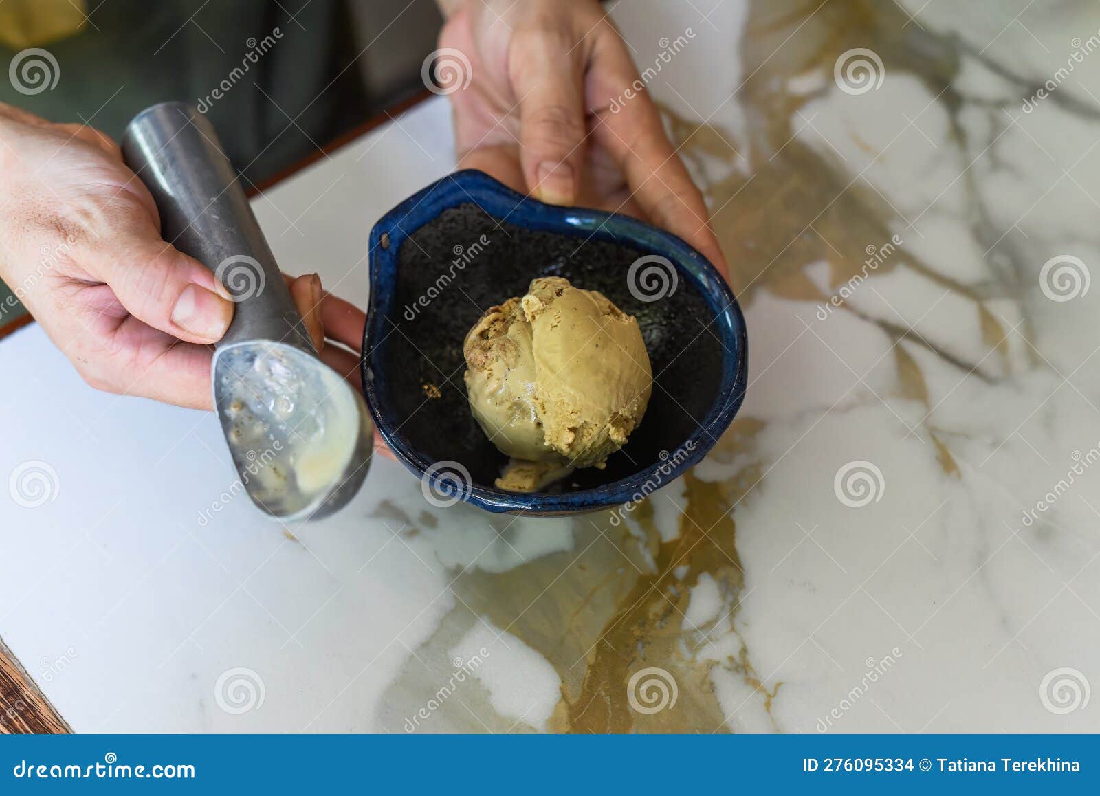 Hand Scooping a Scoop of Ice Cream into a Spoon in Fridge Stock Photo ...