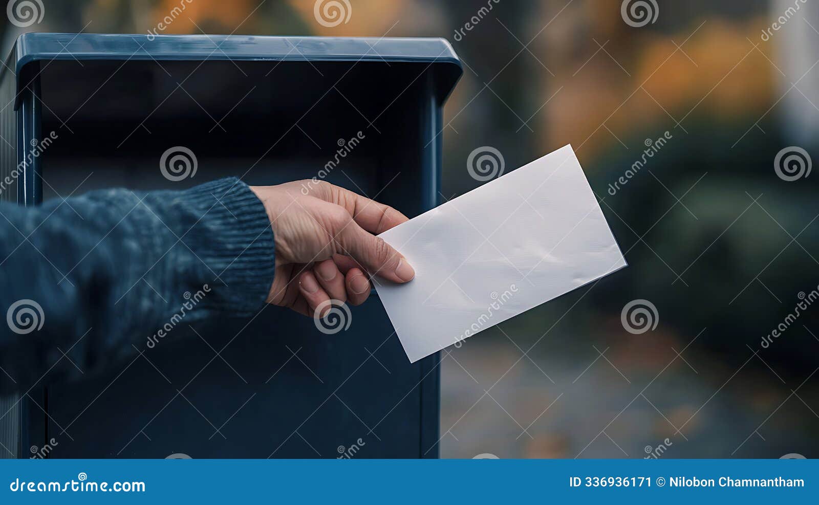 Hand is Seen Dropping White Envelope into Mailbox, Symbolizing ...