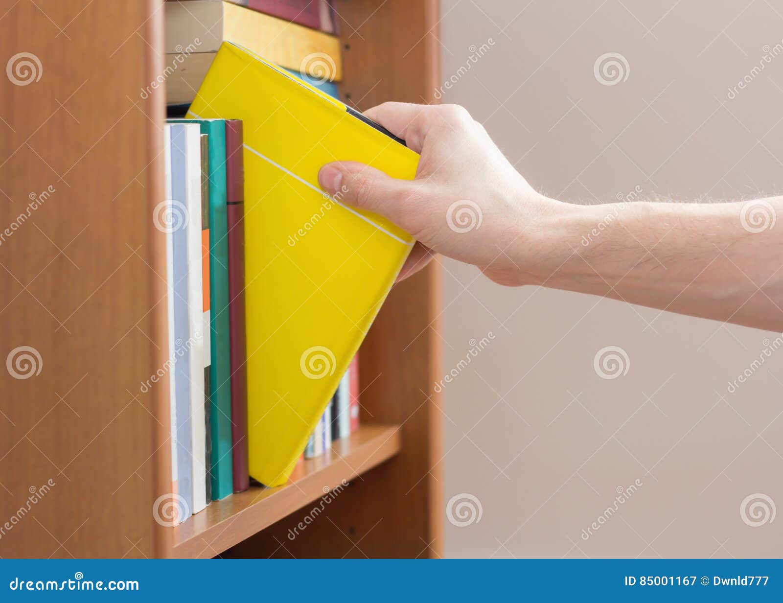 Hand selecting book stock image. Image of learn, yellow - 85001167