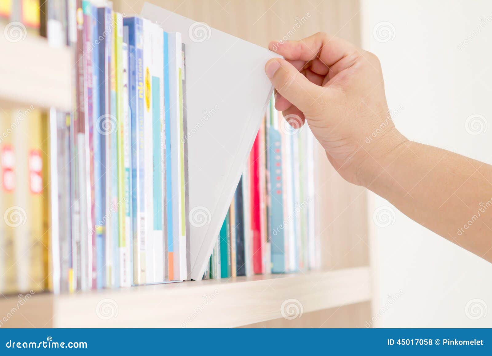 Hand Selecting Book from Bookshelf Stock Photo - Image of education ... Hand Selecting Book from Bookshelf Stock Photo - Image of education ...