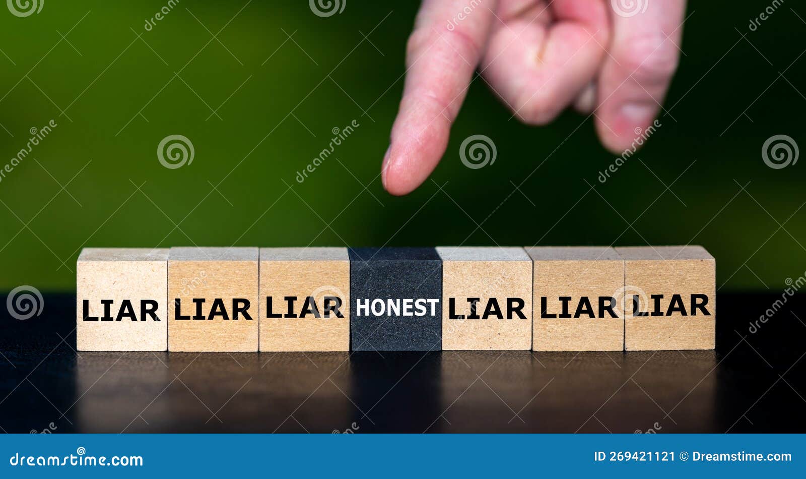 Hand Selects the Cube with the Word Honest instead of Cubes with the ...