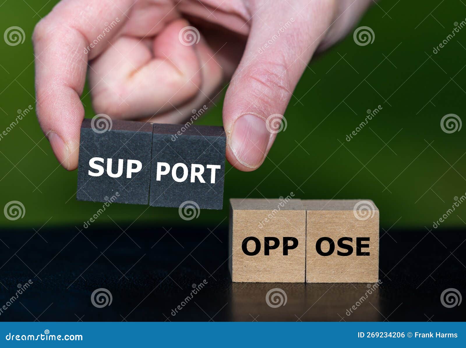 Hand Selects Wooden Cubes with the Word Support instead of Cubes with ...