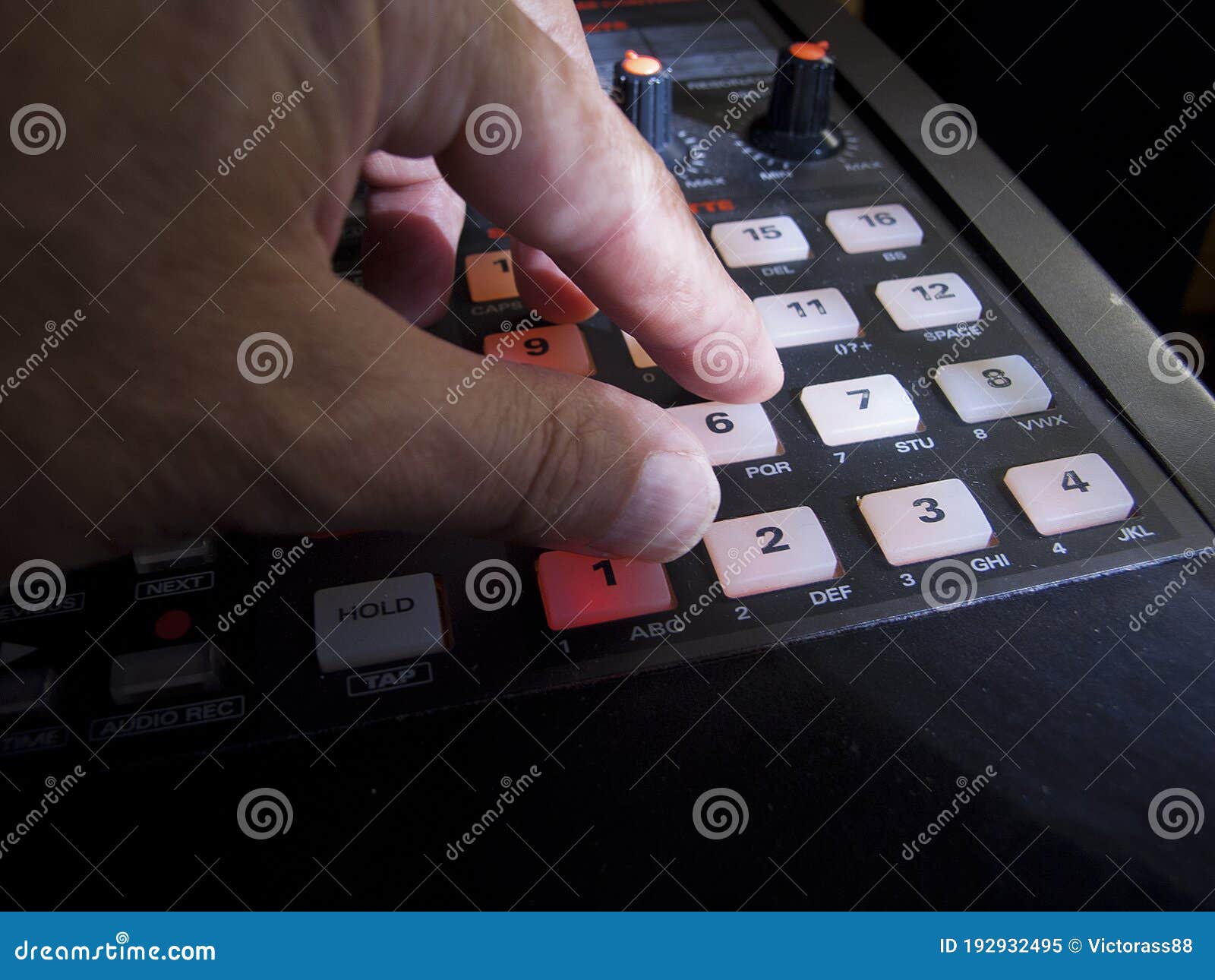 Hand on retro sampler stock image. Image of macro, electronic - 192932495