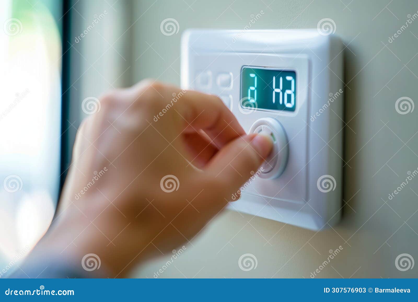 Hand Setting the Temperature on the Thermostat in Modern Home ...