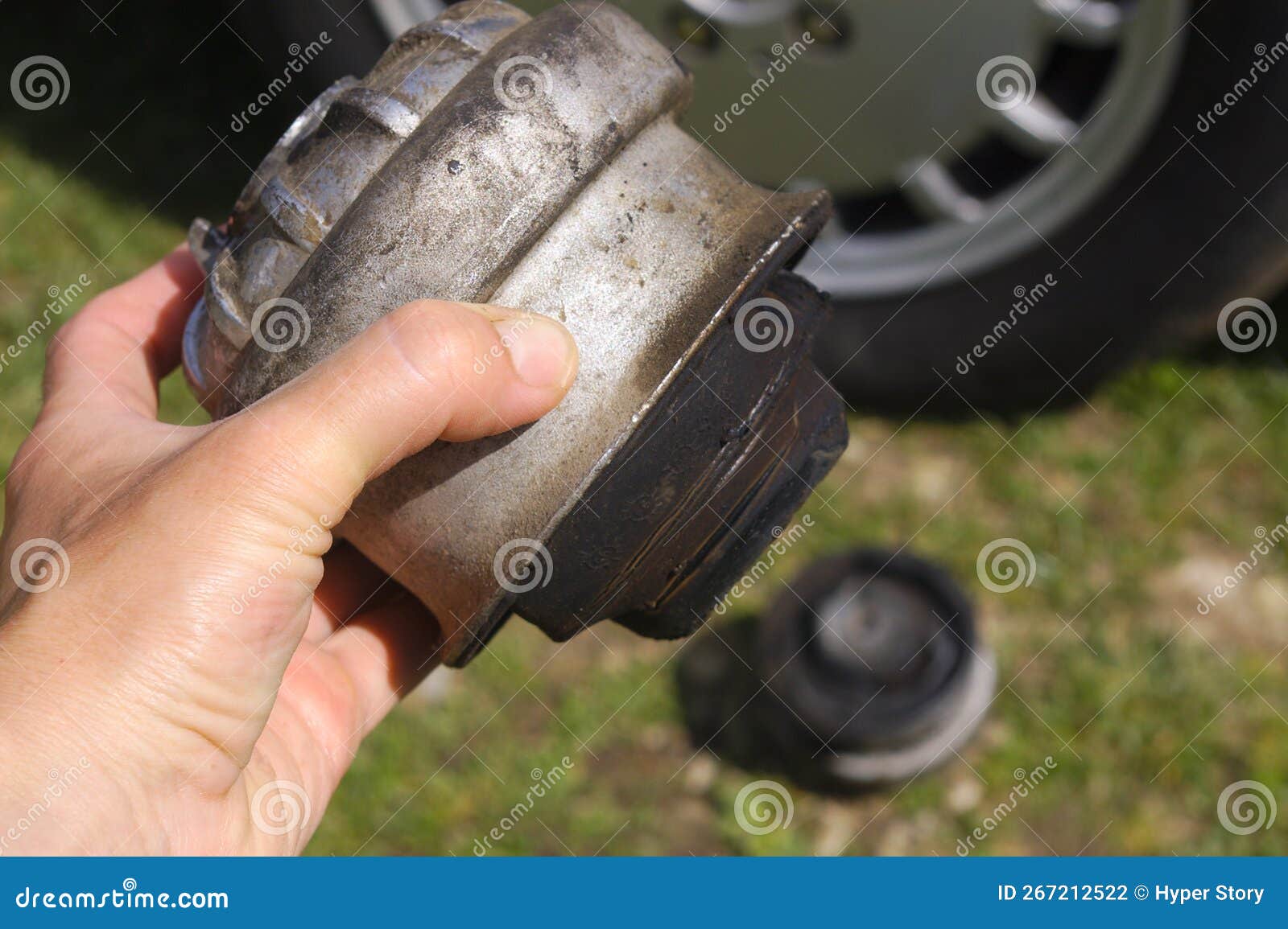 Hand with Severely Used Engine Mounts. Changing Old Rubber Car Pads ...