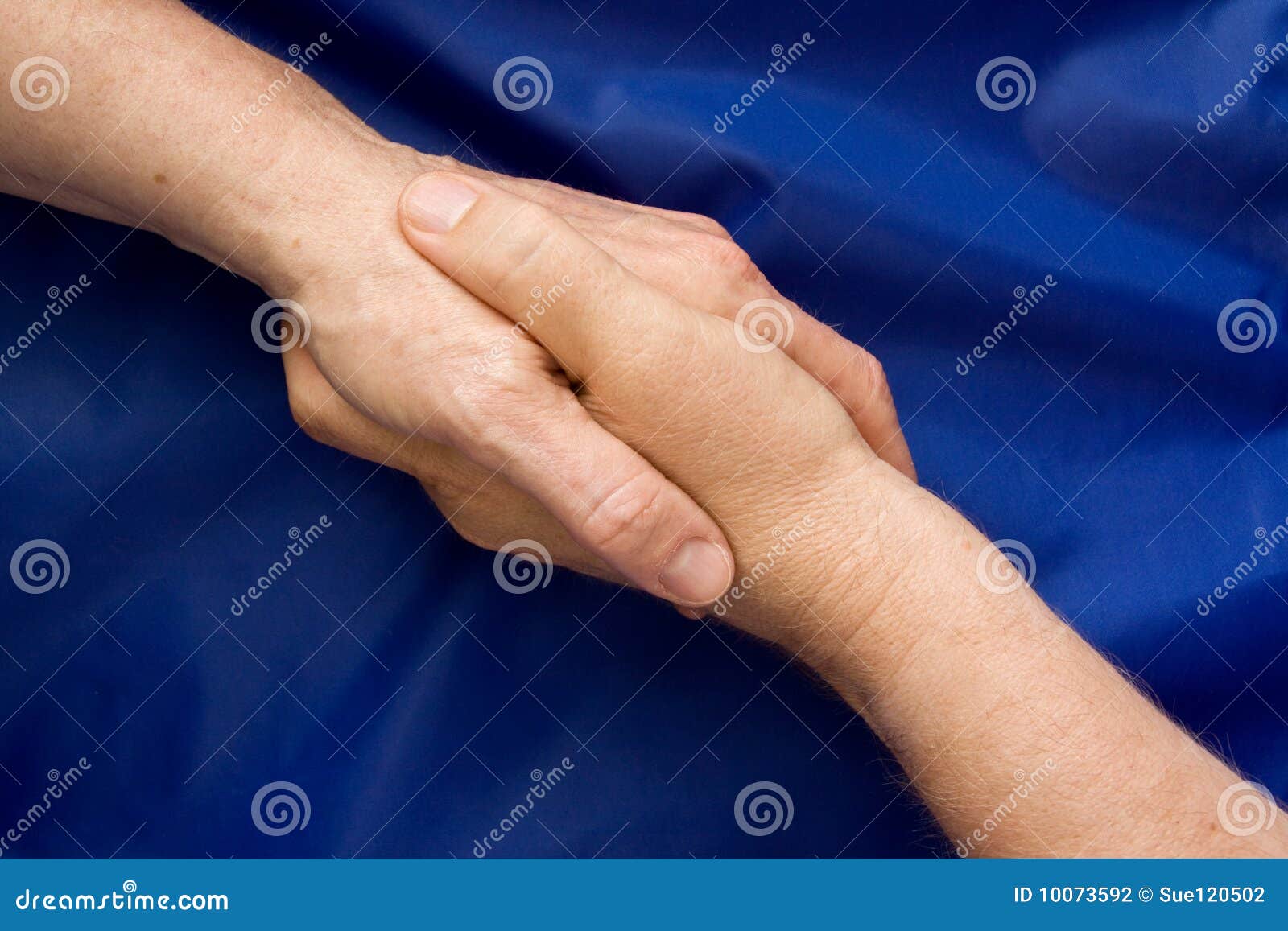 Hand Shake Against a Blue Background Stock Photo - Image of equal ...