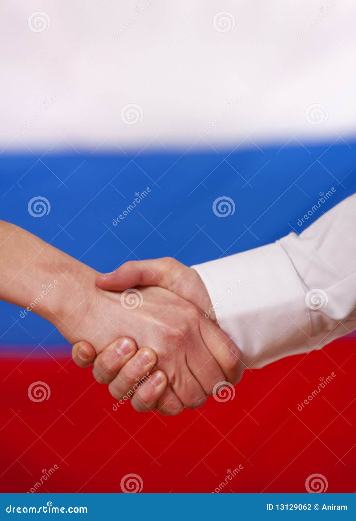 Hand Shake Over Russian Flag Stock Photo - Image of friendship, flag ...