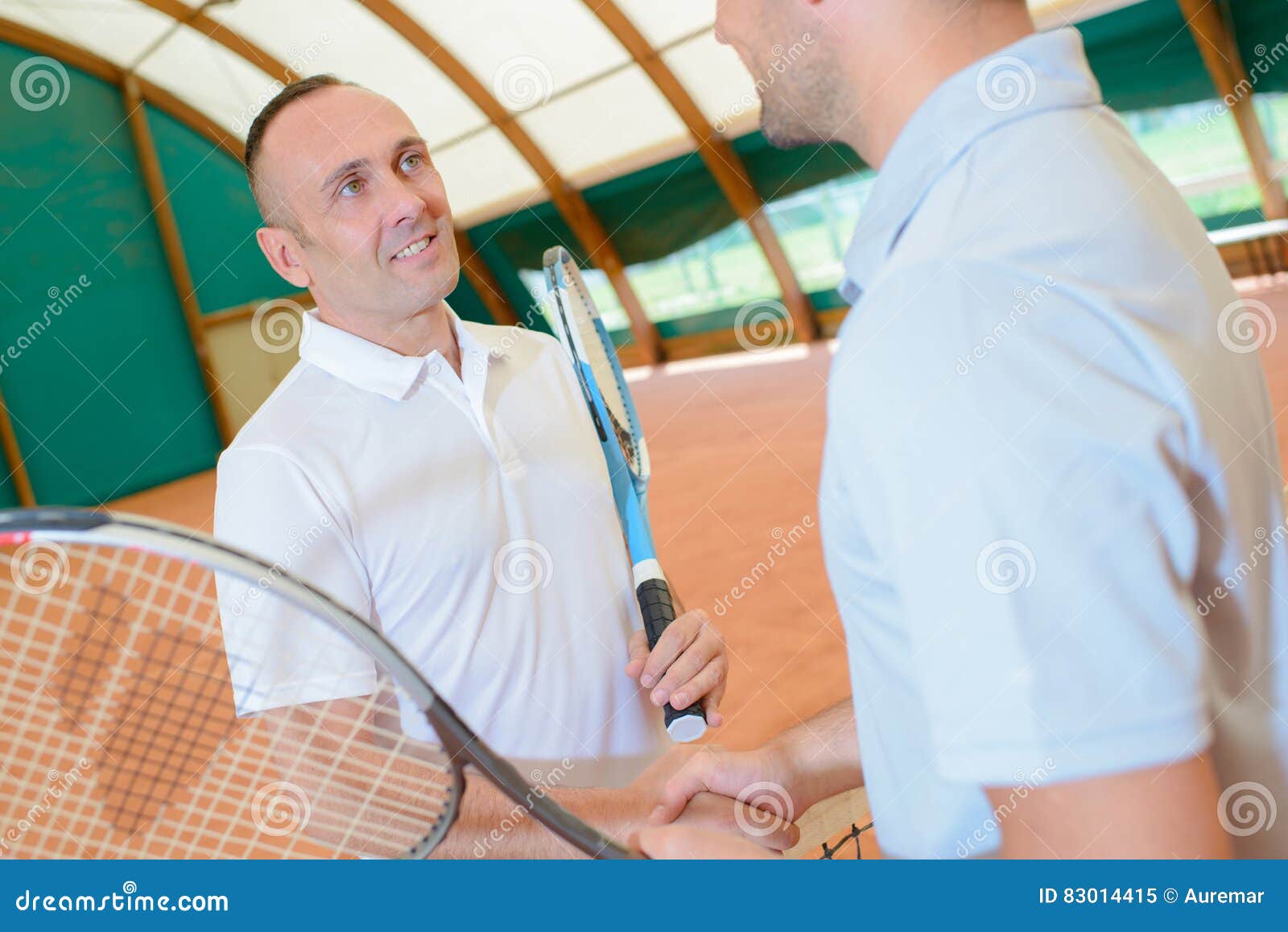 Hand shake at tennis court stock image. Image of game - 83014415