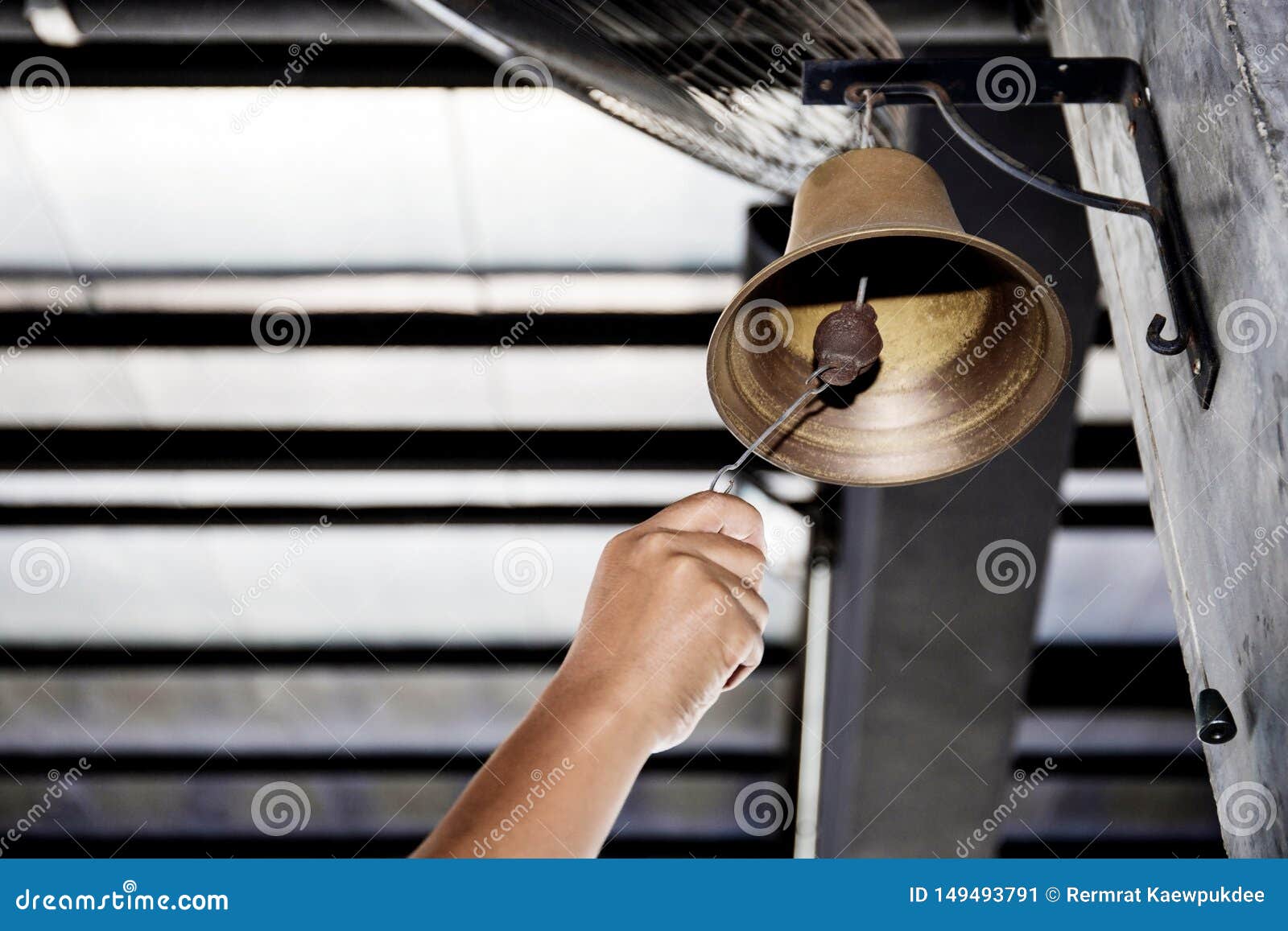 Hand is shaking bell stock image. Image of object, hanging - 149493791