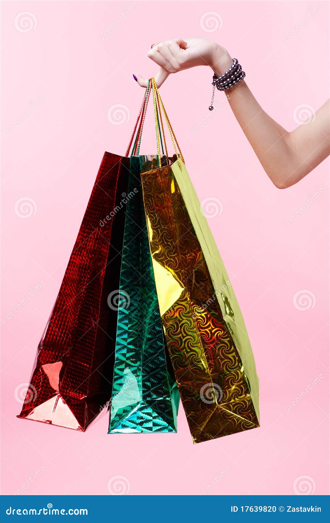 Hand with shopping bags stock photo. Image of glamour - 17639820
