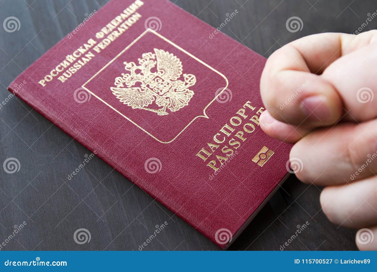 Hand Showing the Fig Sign, on Red Passport Background Stock Image ...
