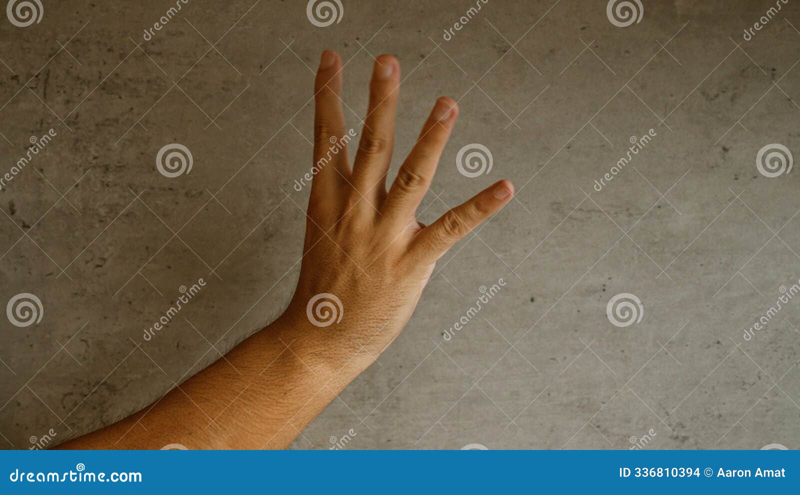 Hand Showing Four Fingers Against a Concrete Background Stock Photo ...